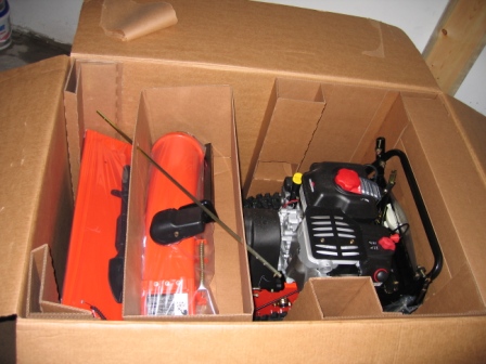 Open the snow blower box to find the manual