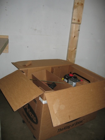 Open the snow blower box to find the manual